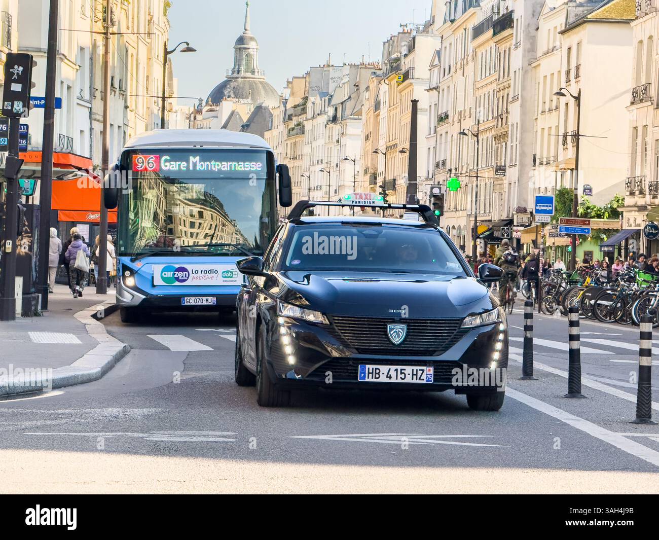 Paris street, taxi and bus in downtown. France Stock Photo - Alamy