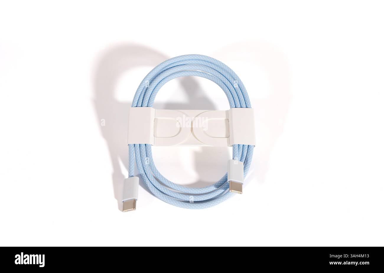 Blue cord with white plastic on it. The cord is attached to white ...