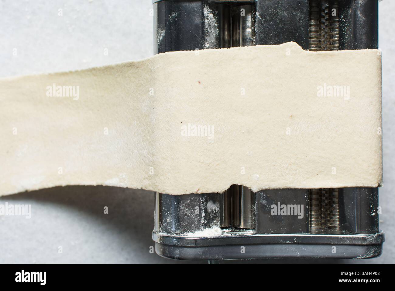 Overhead view of dumpling wrappers dough being rolled out, process of ...