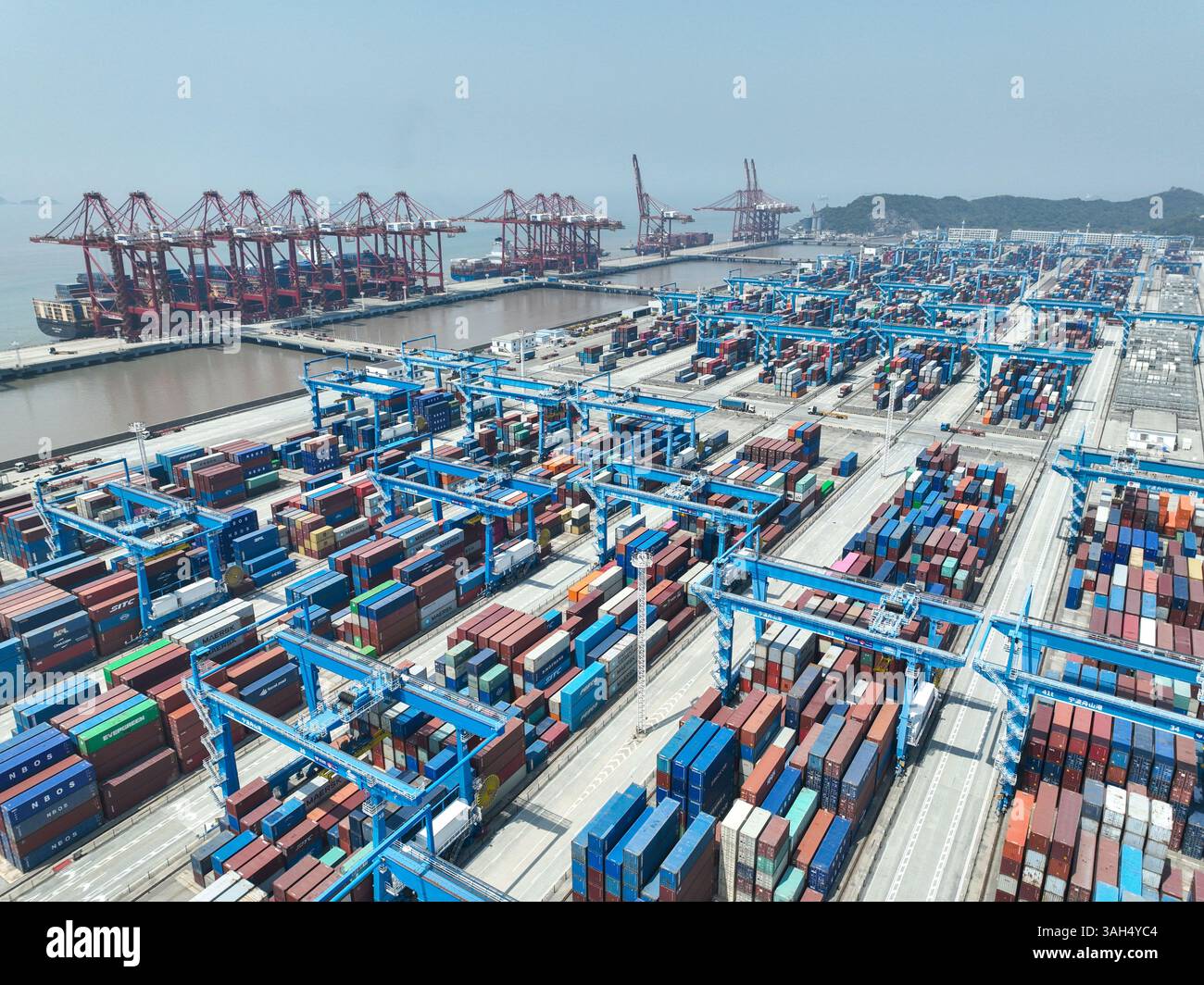 Ningbo, China. 06th Apr, 2025. Driverless trucks transfer containers at ...