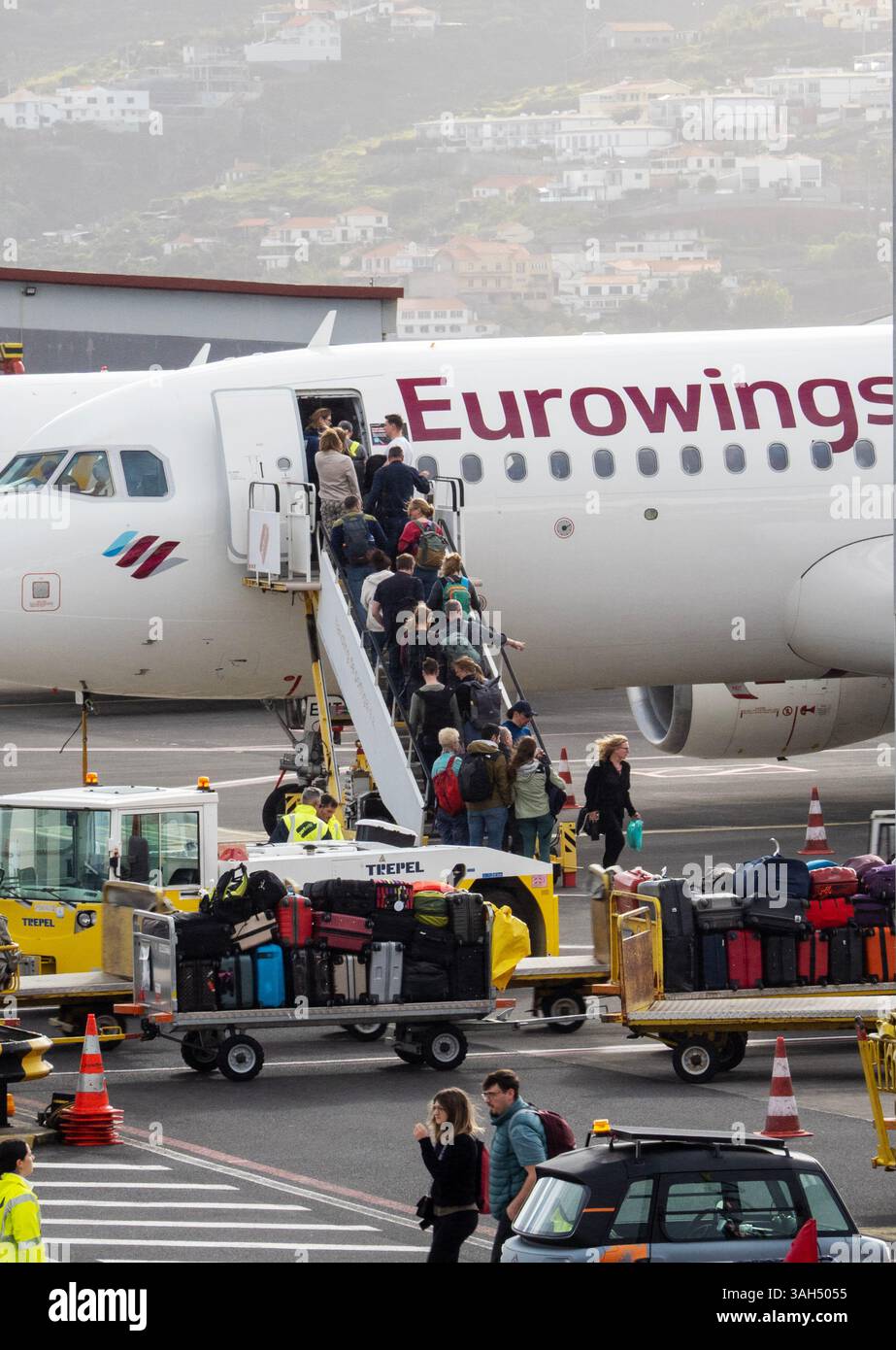 Passengers disembarking a plane at Funchal airport on Madeira Stock ...