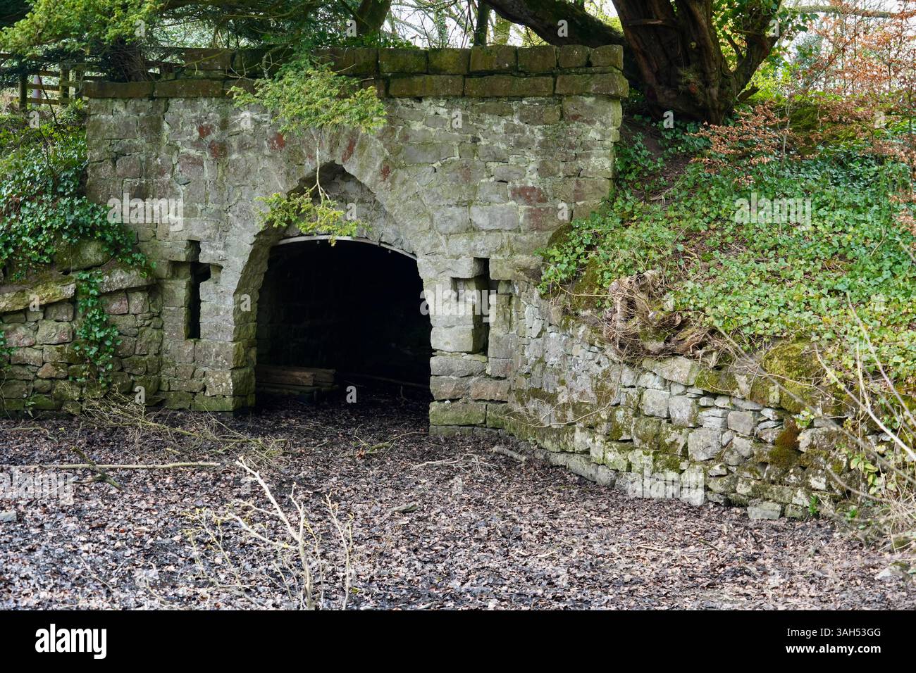 Small stone folly at the corner of Clapham Beck Lake Stock Photo - Alamy