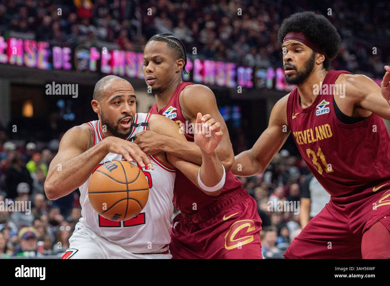 Chicago Bulls' Talen Horton-Tucker (22) drives past Cleveland Cavaliers' Isaac Okoro, rear, and ...