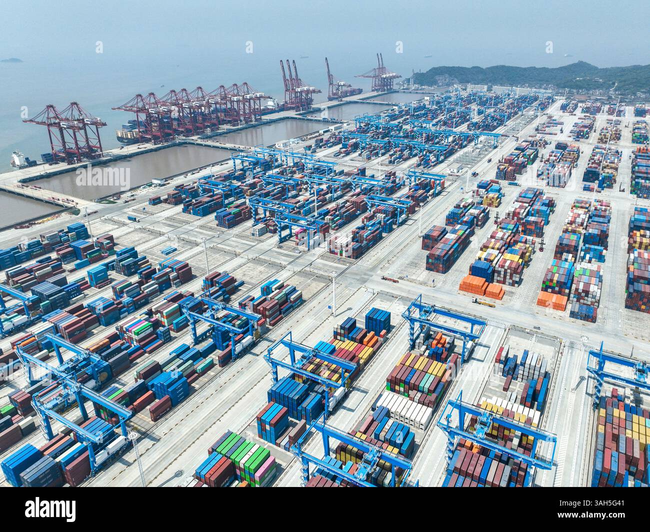 Ningbo, China. 06th Apr, 2025. Driverless trucks transfer containers at ...