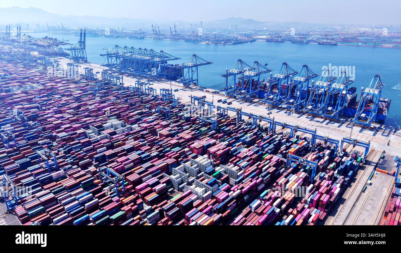 Qingdao, China. 06th Apr, 2025. Cargo ships load and unload containers ...