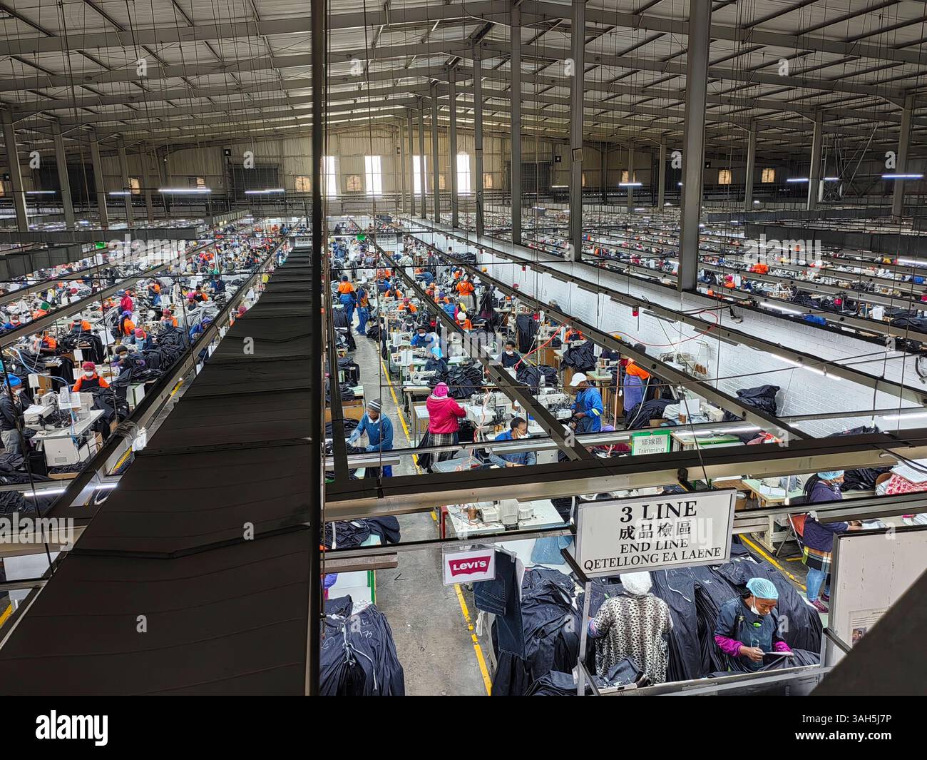 Workers assemble Levi's jeans in the Chinese owned Nien Hsing ...