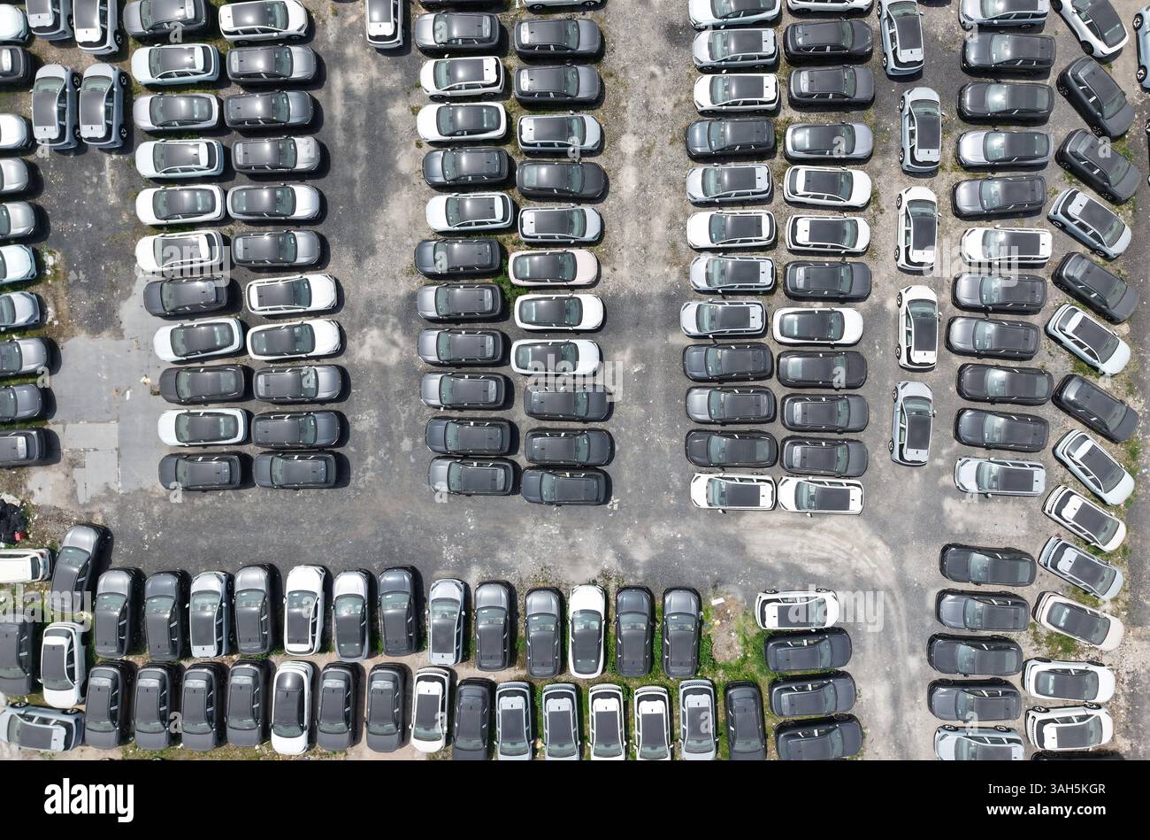 HANGZHOU, CHINA - APRIL 9, 2025 - Cars are parked at a temporary ...
