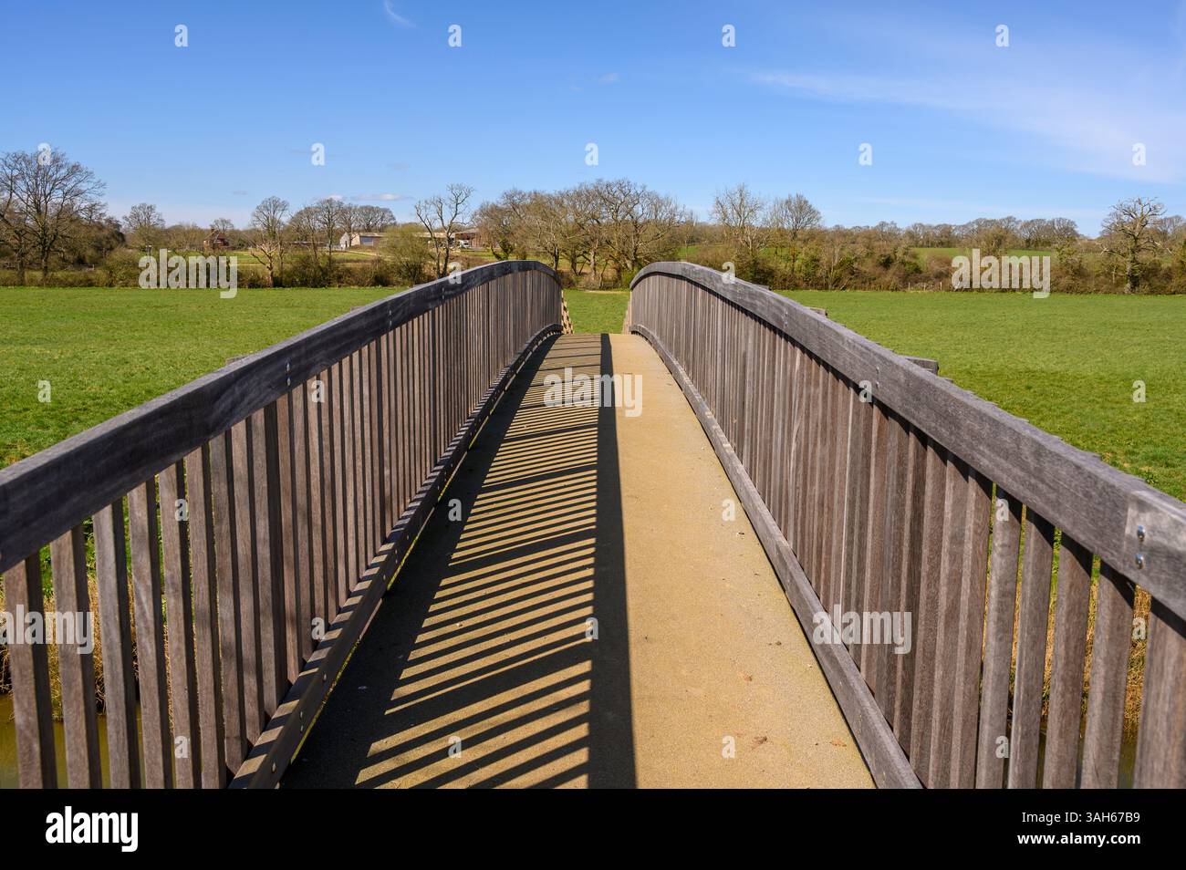 Modern footbridge across River Arun in the countryside near ...