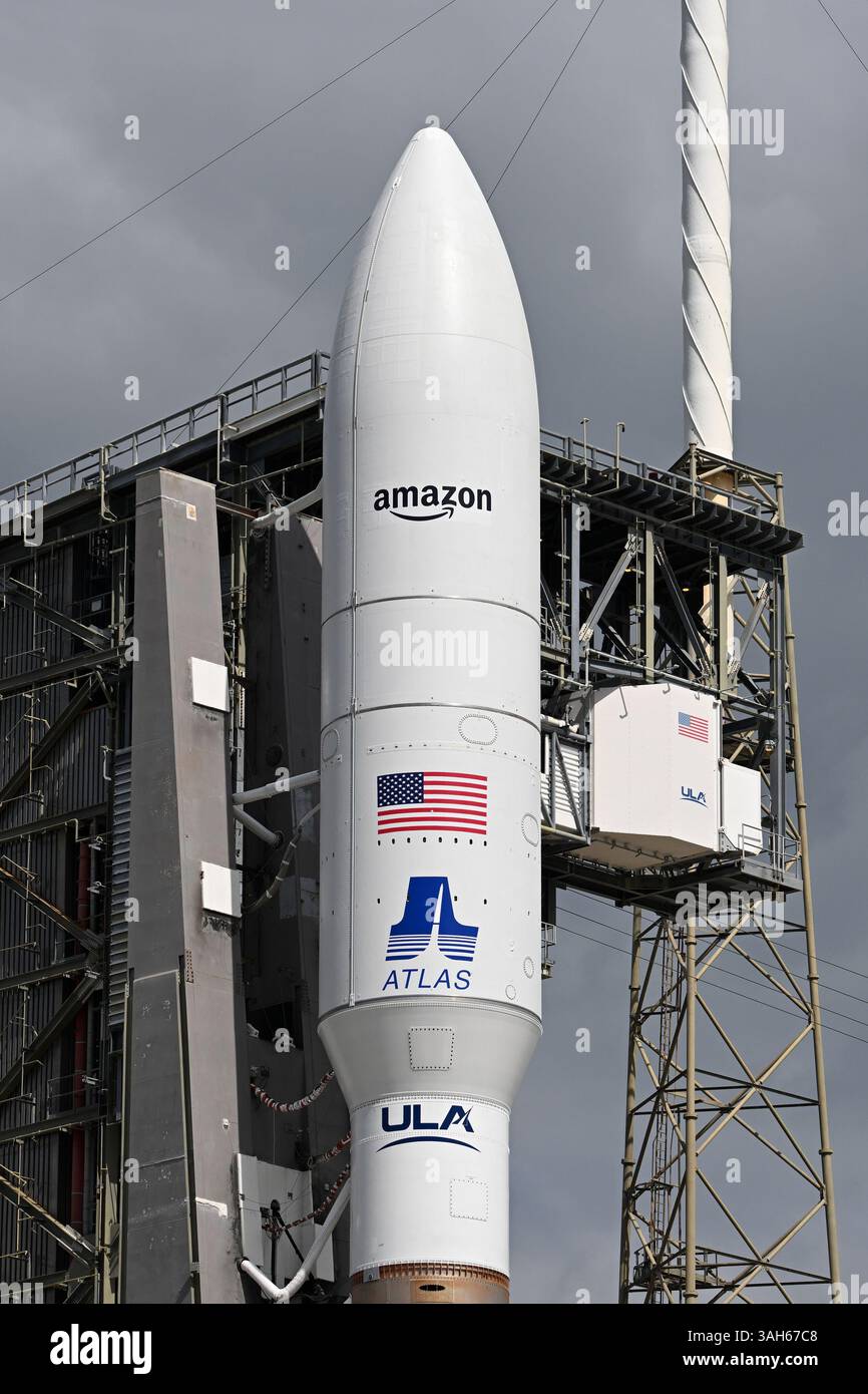 Twenty seven satellites are loaded into the payload fairing on top of ...