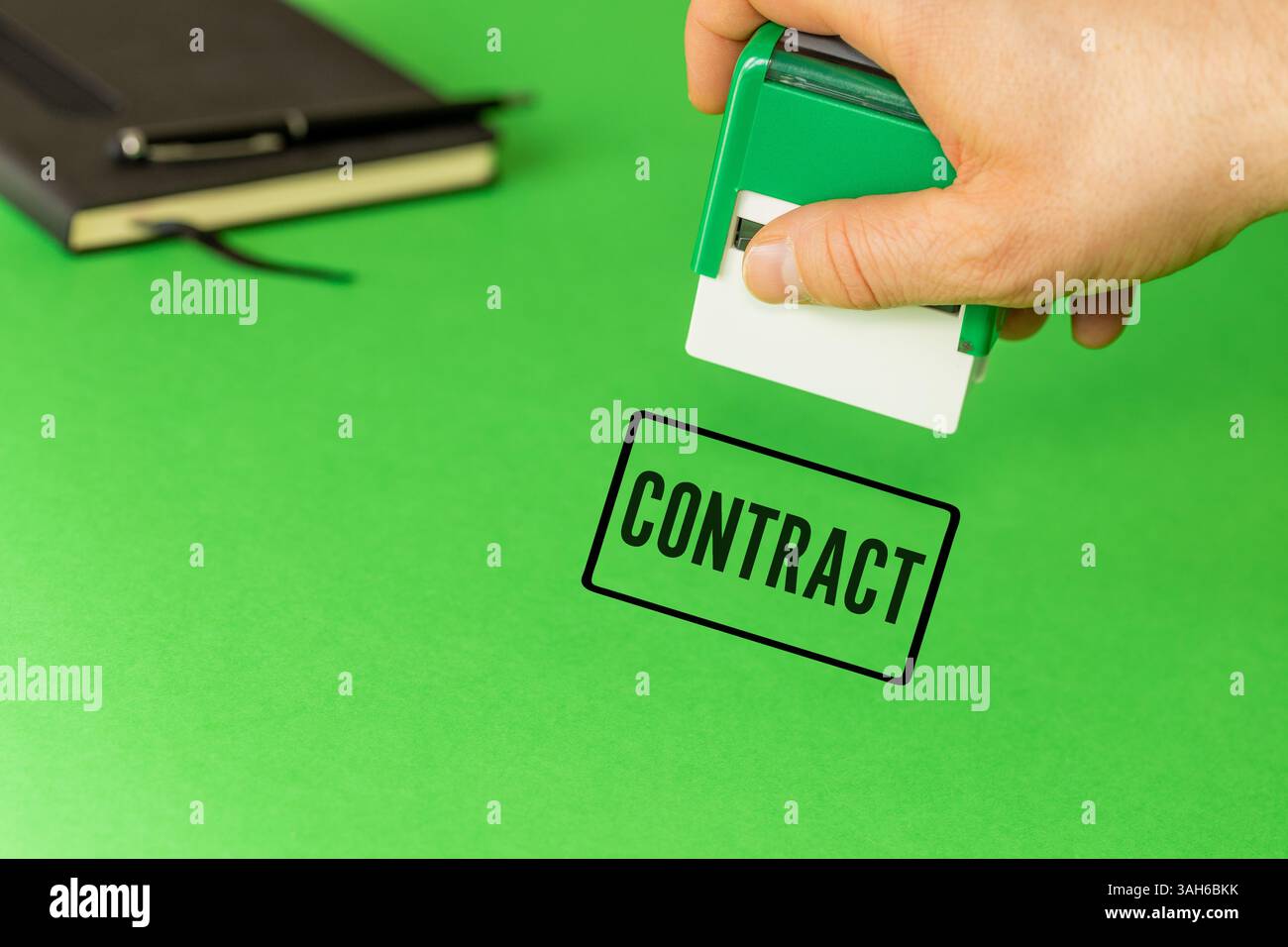 Putting a seal under a signed contract Stock Photo - Alamy
