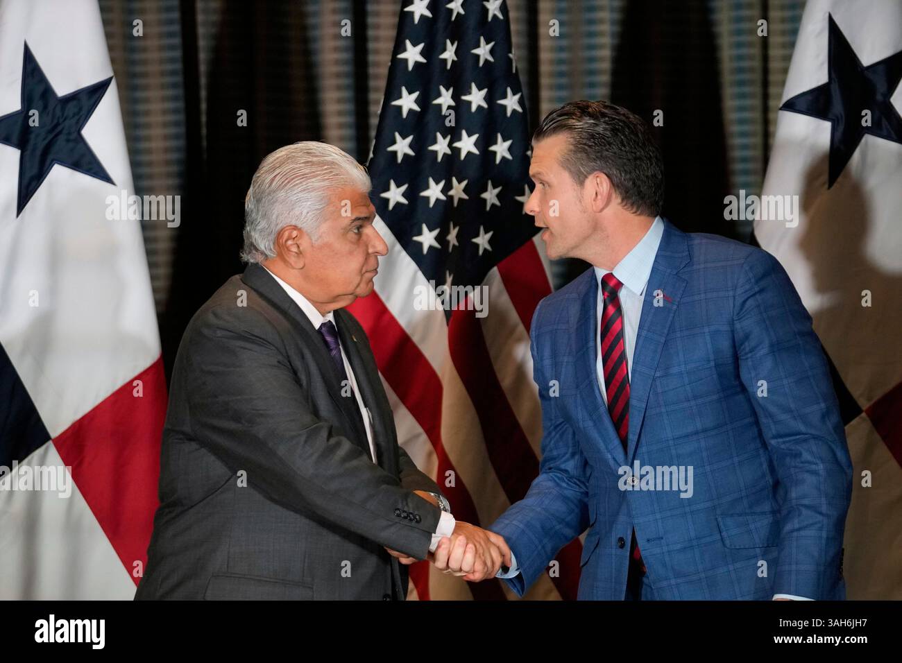 Panamanian President Jose Raul Mulino, left, shakes hand with U.S ...