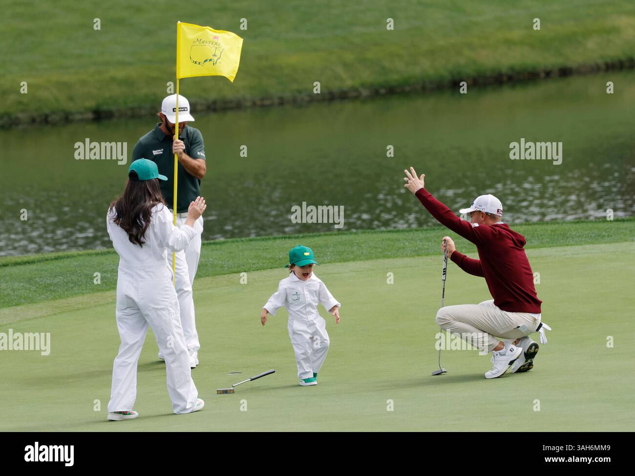 Jordon Thomas waves as Max Homa, his wife Lacey Croom and their son Cam ...