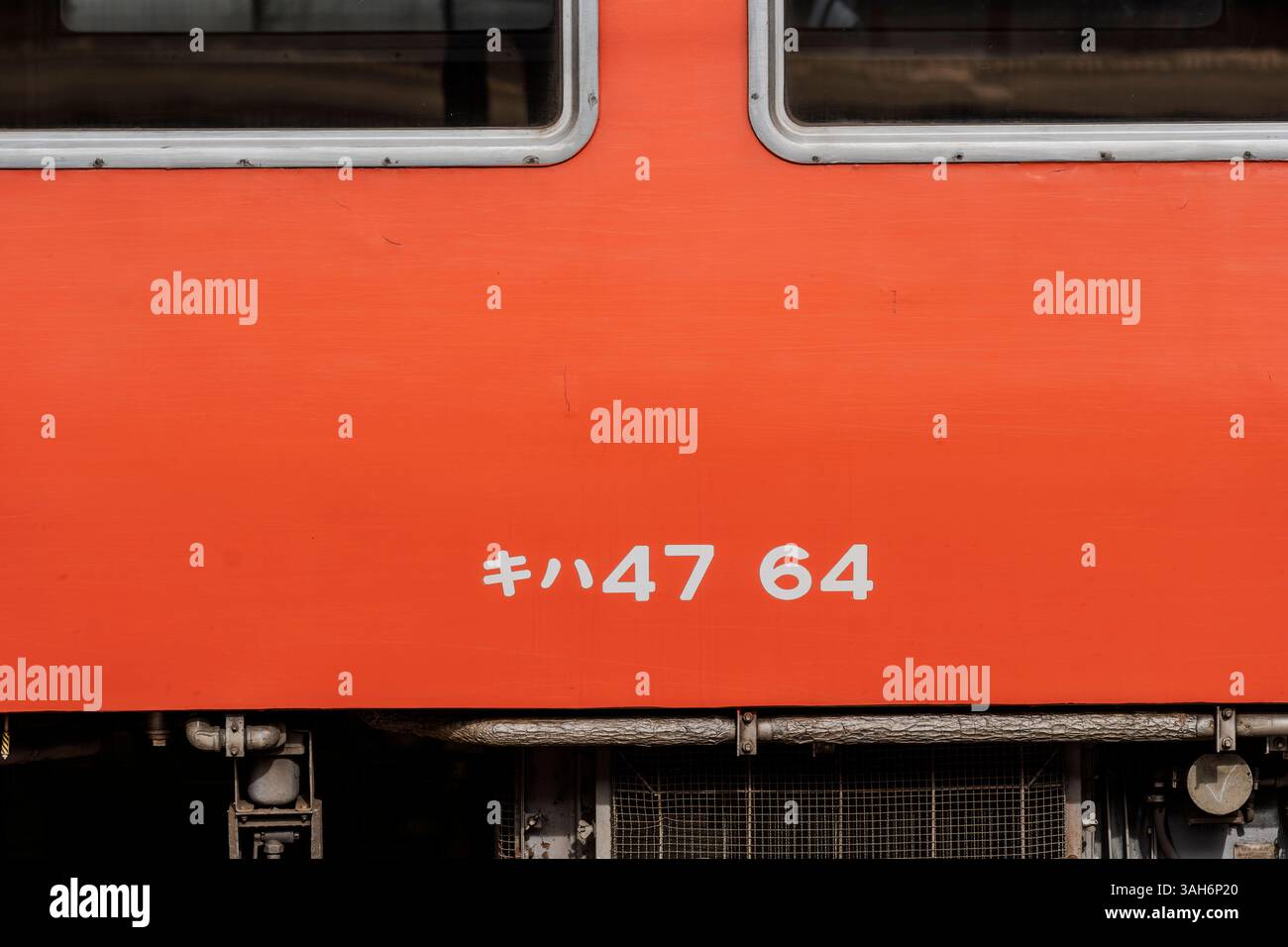The side of a JR West KiHa 47 Series train on the Tsuyama Line at Okayama Station in Japan Stock ...