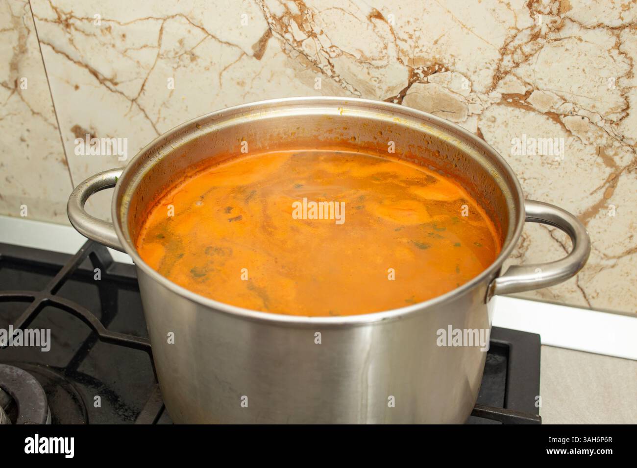 Meat ball soup, as romanian ciorba de perisoare in a steel pot ...