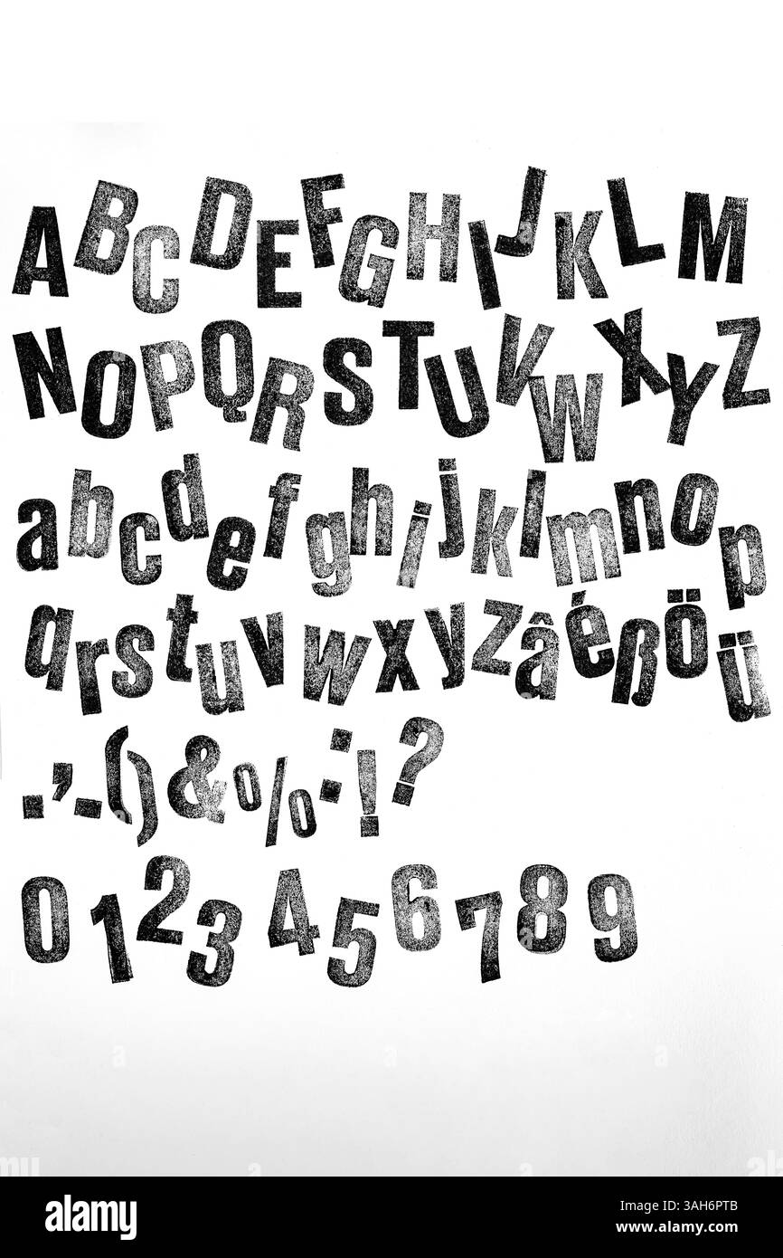 Scattered stamp letters with black ink ,alphabet on white background ...
