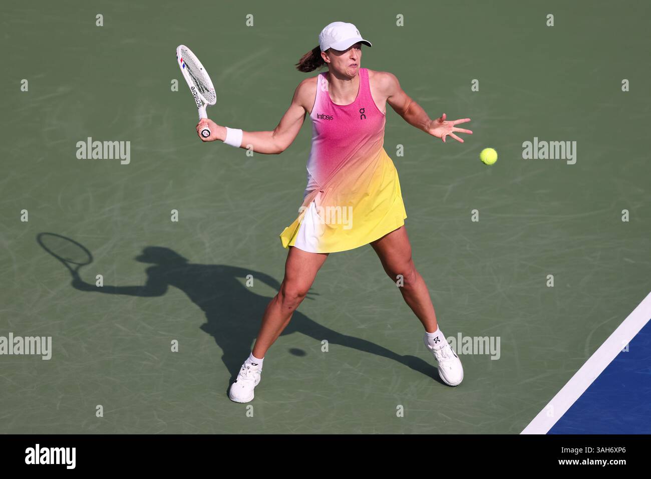 Polish tennis player Iga Swiatek playing a forehand shot at the 2025 ...