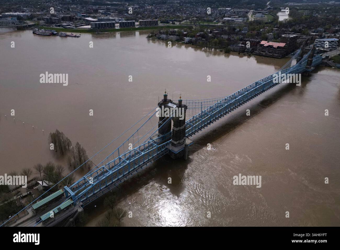 The John A. Roebling Suspension Bridge is seen as the Ohio River is ...
