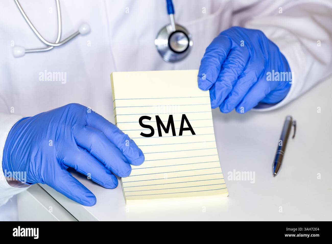 SMA disease, Doctor shows notebook with word SMA Genetic. spinal ...