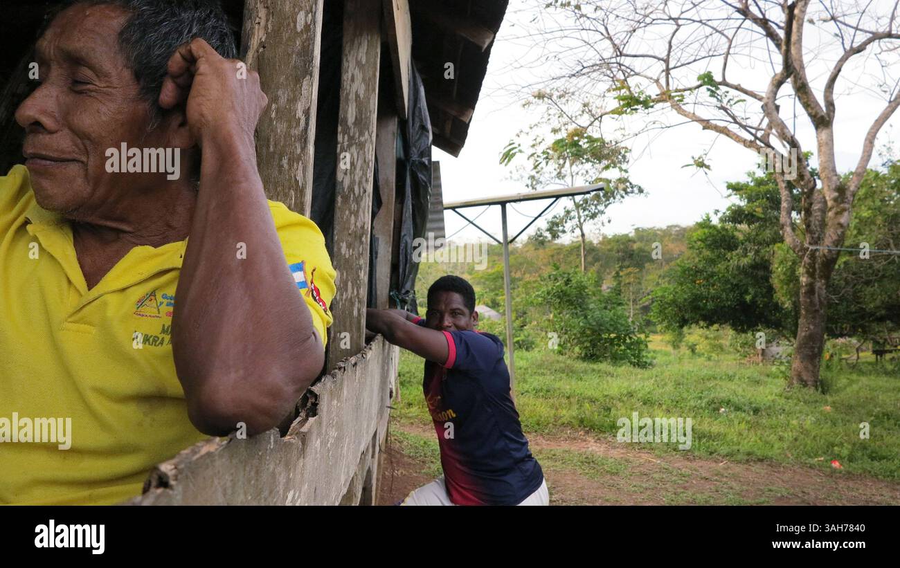 March 17, 2015 - Bangkukuk, NIC - Two Rama indigenous men pass the time ...