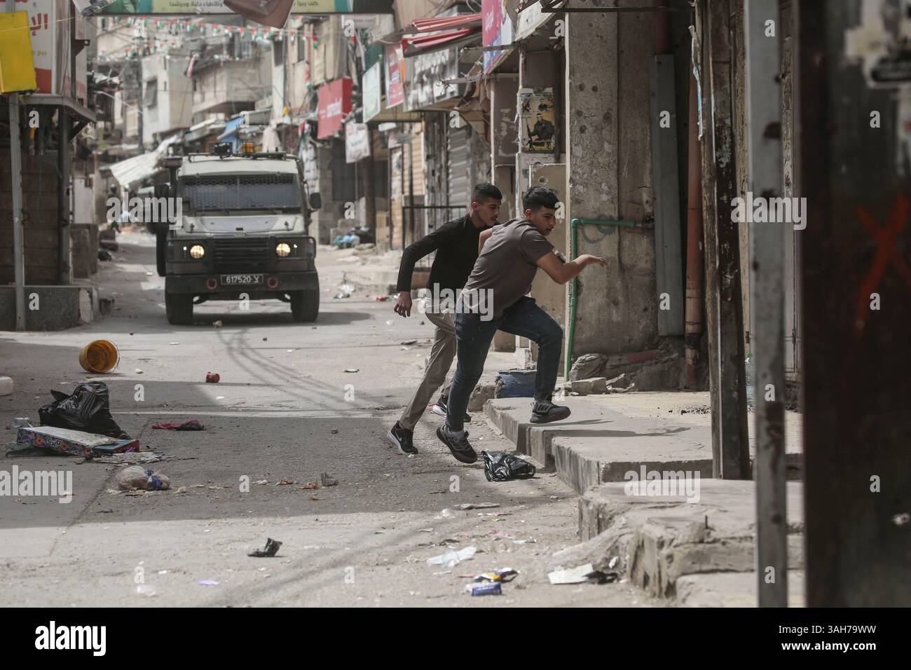 Nablus, Palestine. 09th Apr, 2025. Palestinian youths throw stones at ...