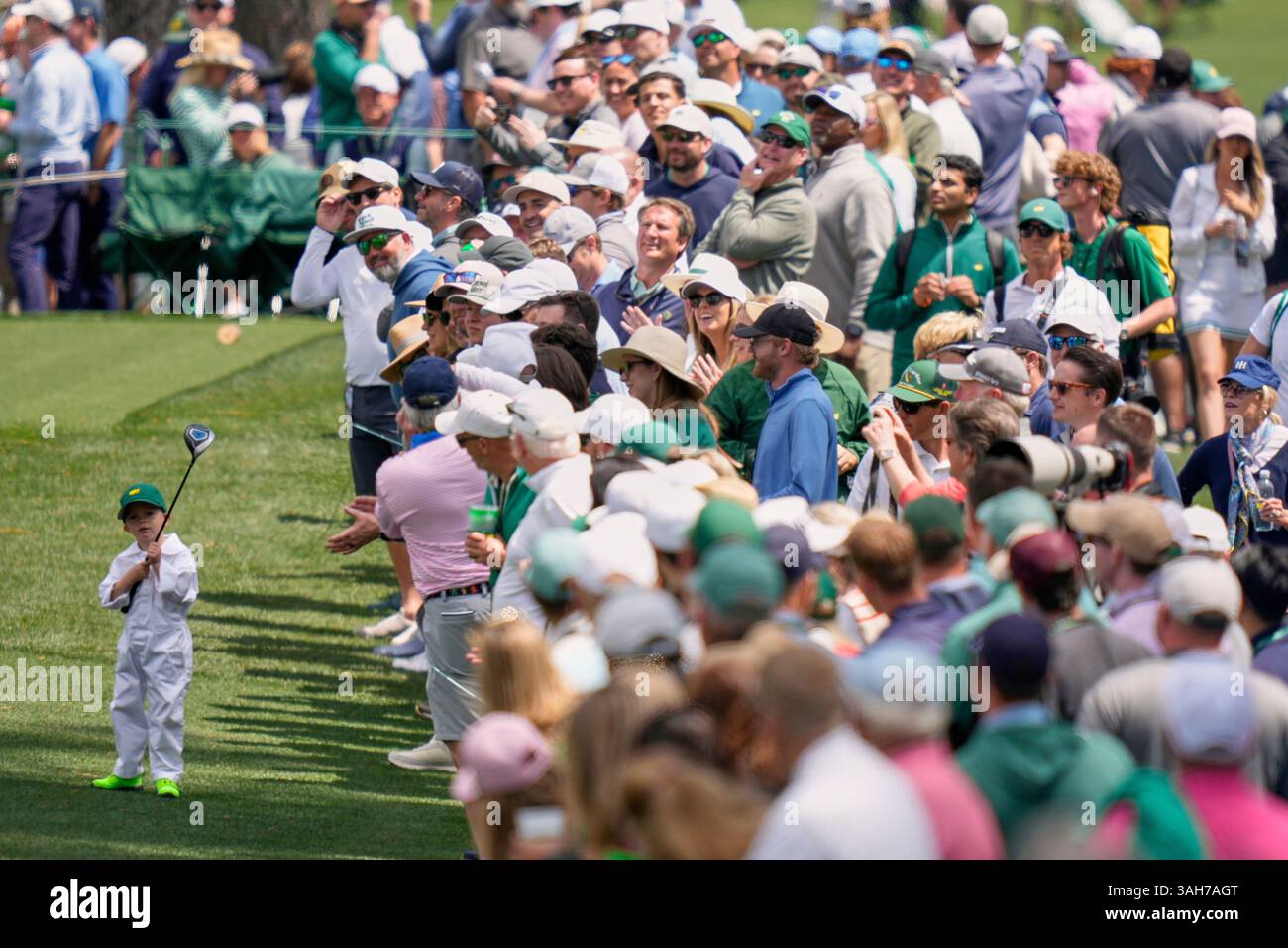 Jordan Spieth's son Sammy watches his shot on the seventh hole during ...
