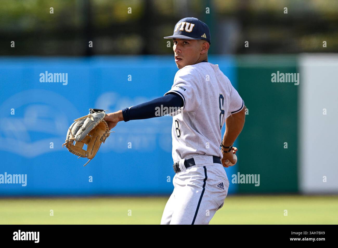 Florida International infielder Adonys Velez (8) throws during an NCAA ...