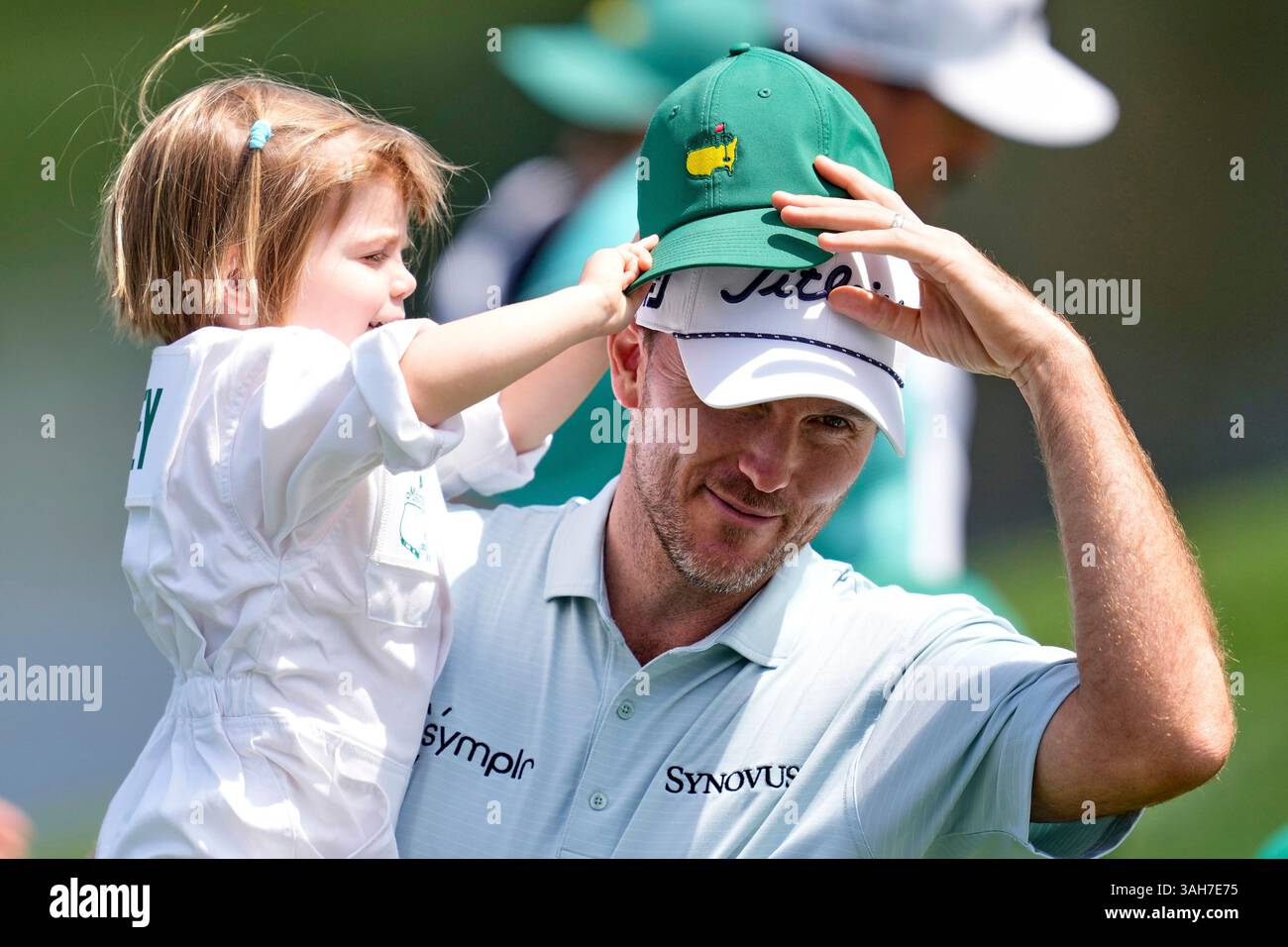 Russell Henley and daughter, Jane, 2, interact on the first hole during ...