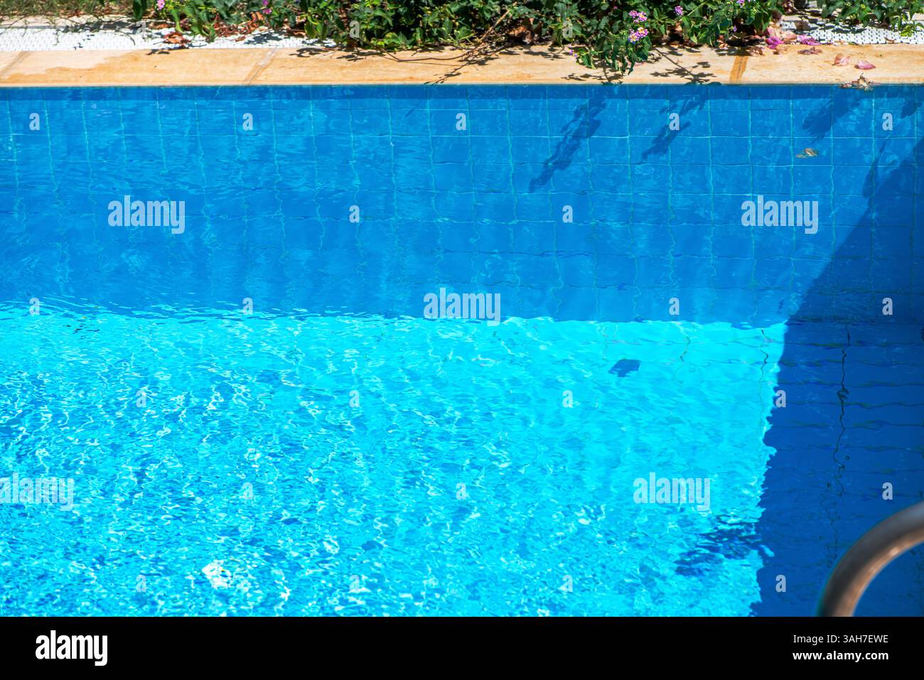 A vibrant summer photo showcasing the crystal-clear blue water of a ...