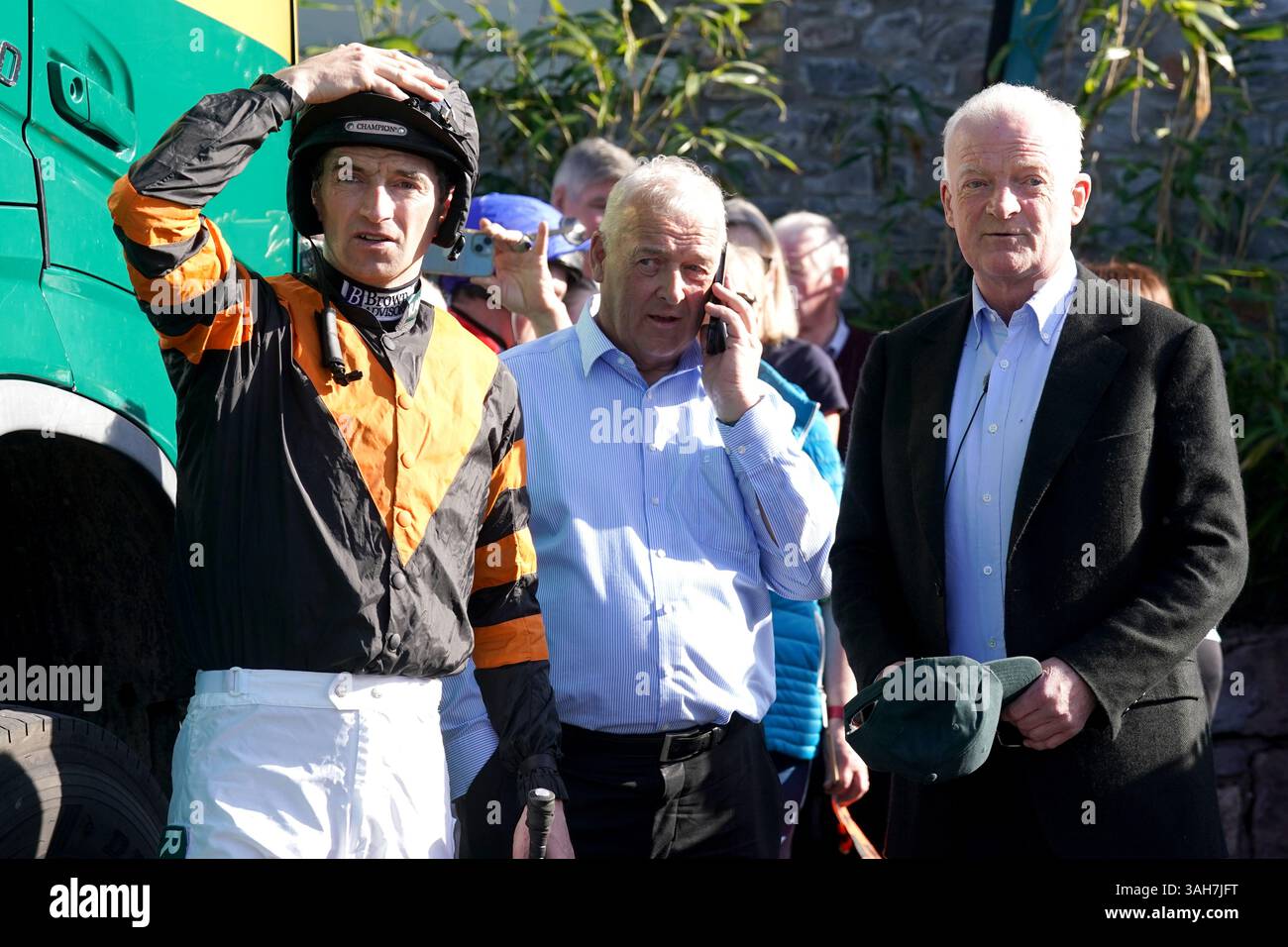 Grand National winning jockey Patrick Mullins with trainer Willie Mullins during the 2025 Randox ...