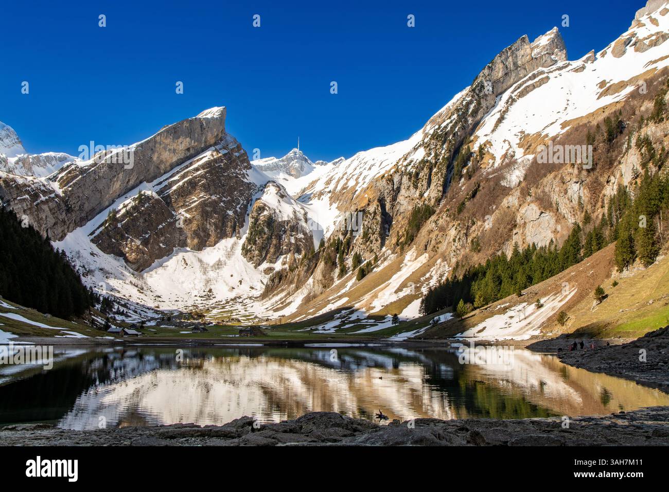 Seealpsee beautiful reflections in the morning in spring, Alpstein with ...