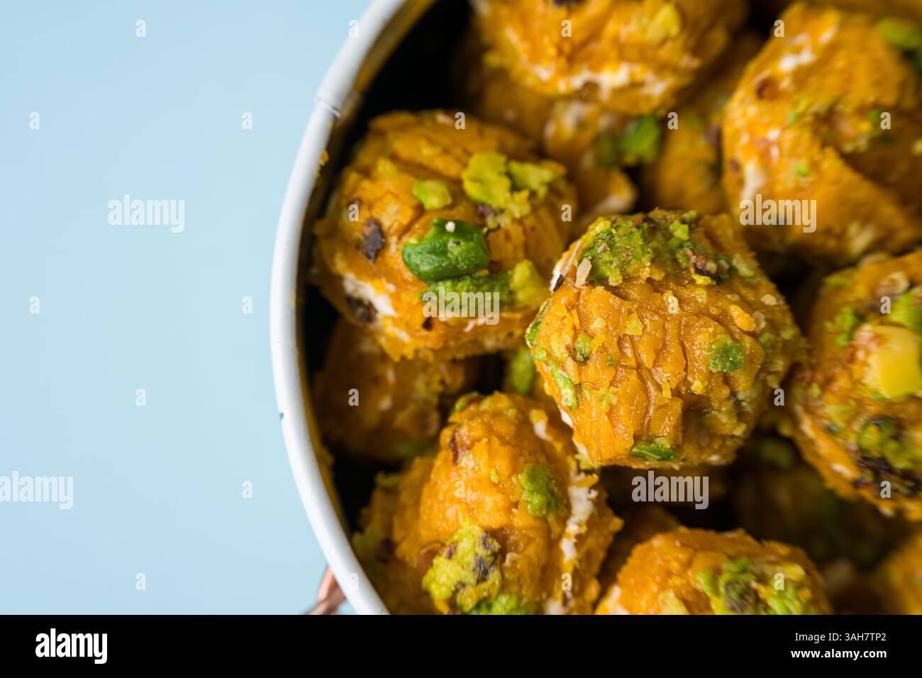 Sohan Dessert, the traditional famous Iranian dessert on a blue ...