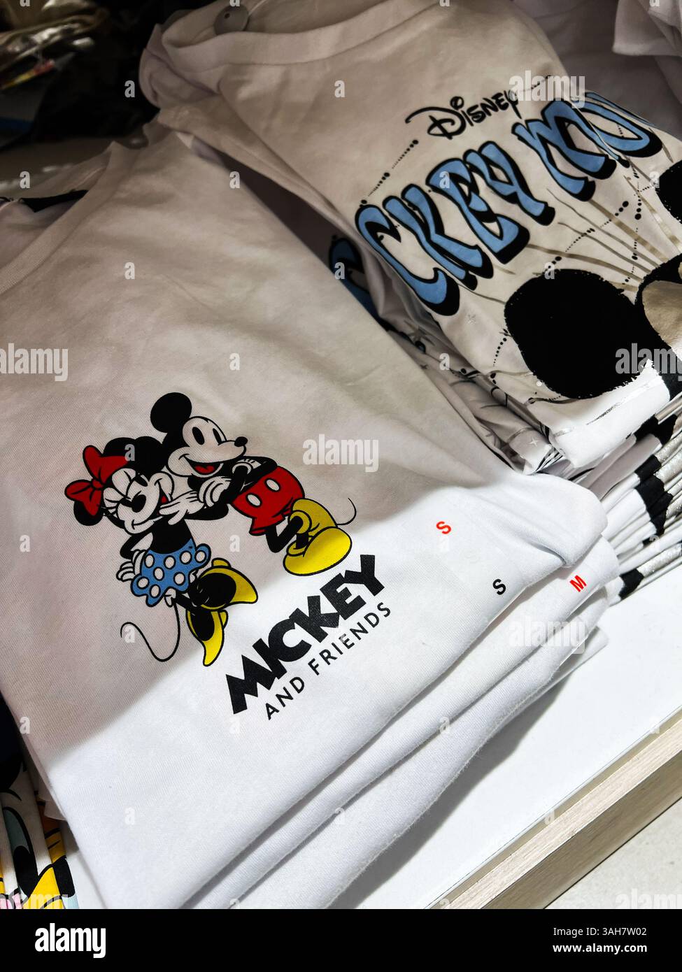 Kyiv, Ukraine - April 08, 2025: Stack of Mickey Mouse white t-shirts ...