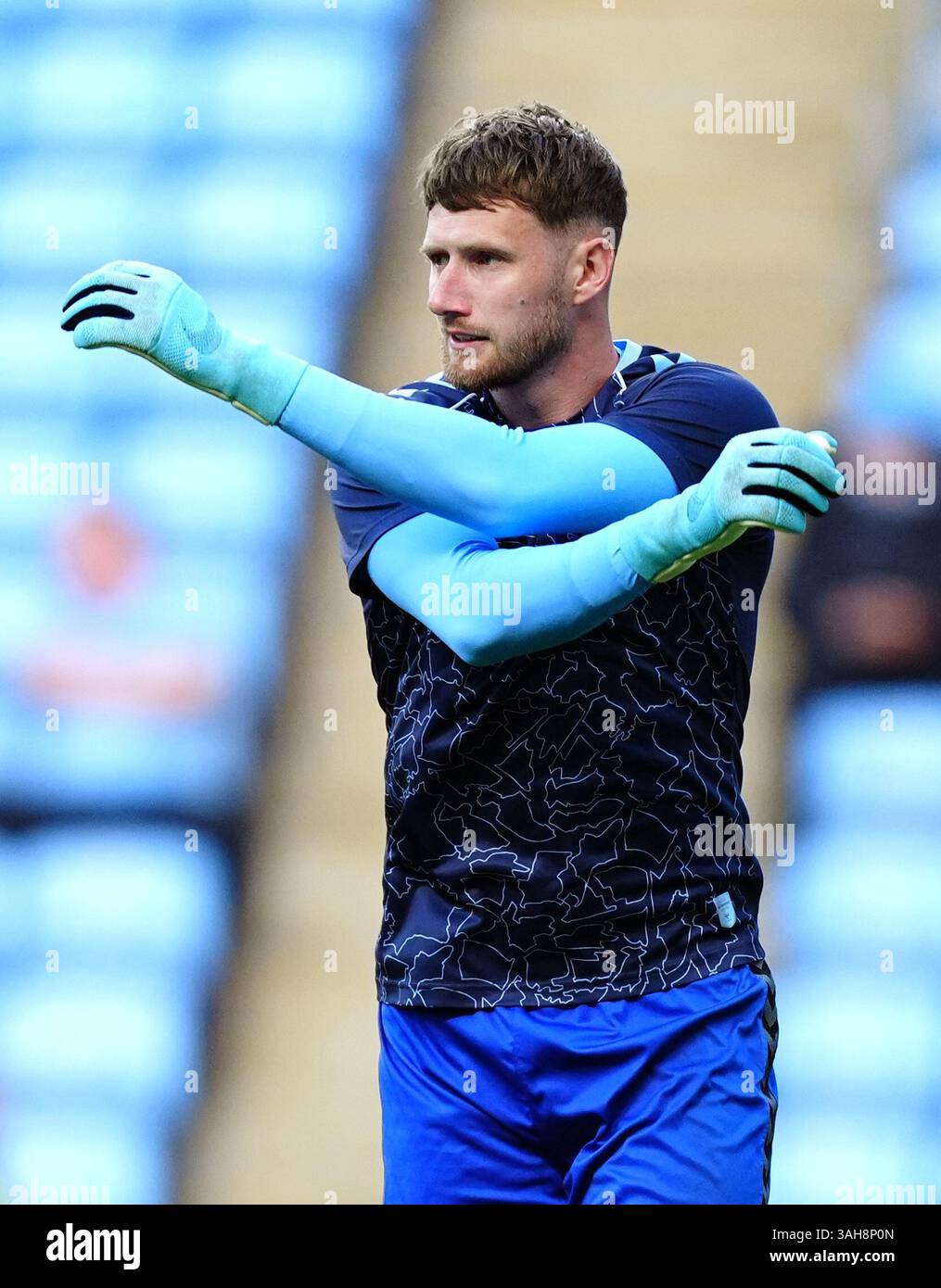 Coventry City goalkeeper Bradley Collins warming up before the Sky Bet ...