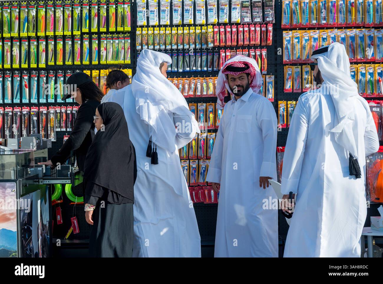 FIRST FISHING EXHIBITION IN QATAR People visit a stall selling fishing ...