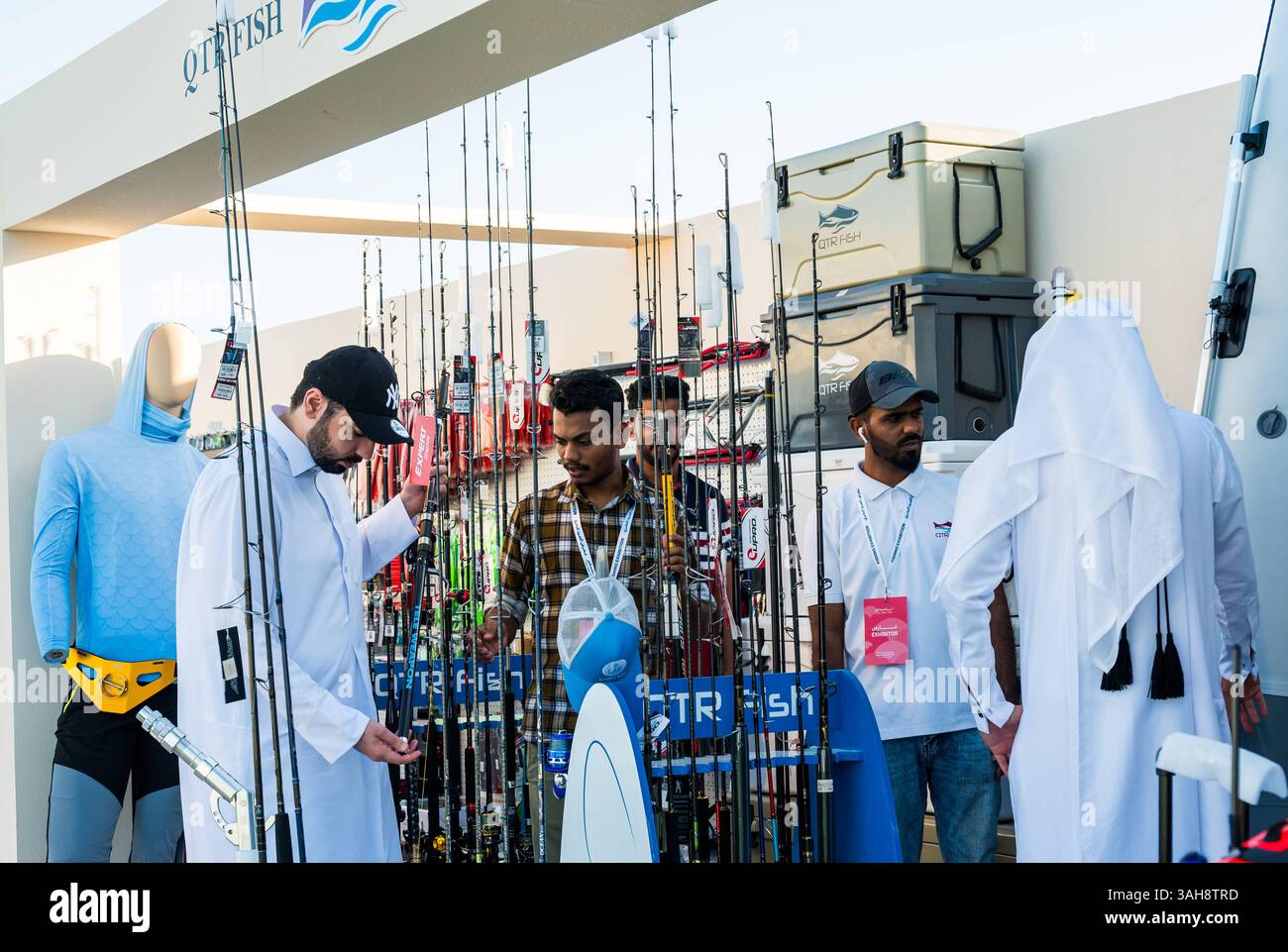 FIRST FISHING EXHIBITION IN QATAR People visit a stall selling fishing ...