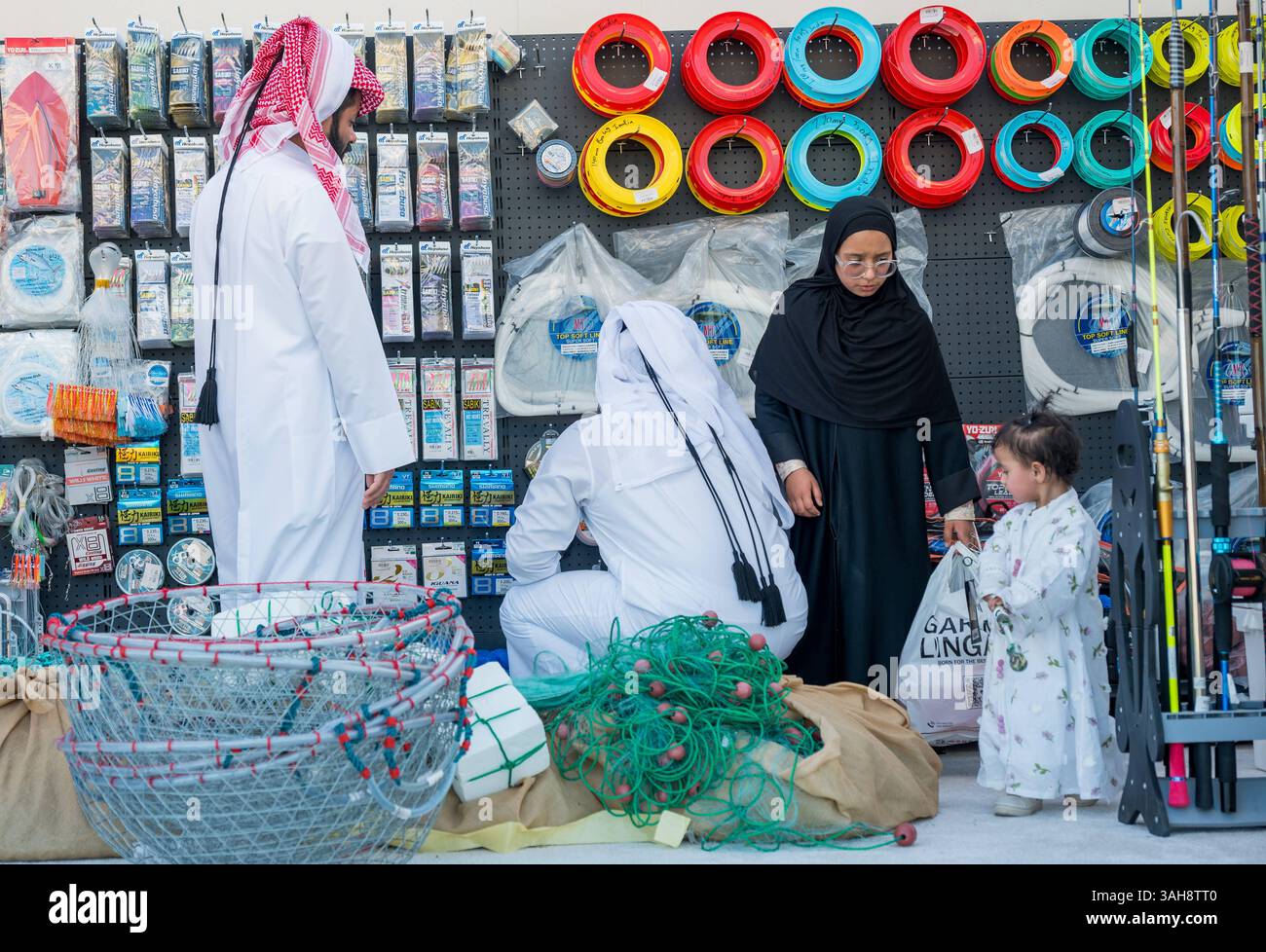 FIRST FISHING EXHIBITION IN QATAR People visit a stall selling fishing ...