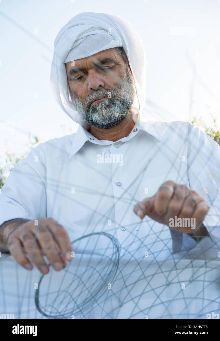 FIRST FISHING EXHIBITION IN QATAR A Qatari man display their skills on ...