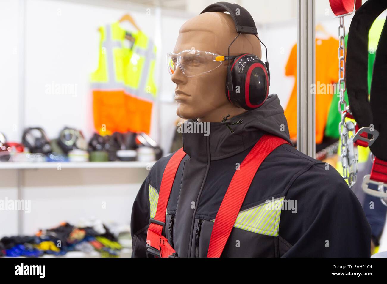 Male mannequin in work clothes, safety glasses and headphones on the ...
