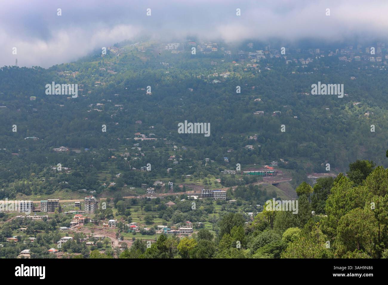 Lush green summer views of Murree, Punjab, Pakistan: houses and ...