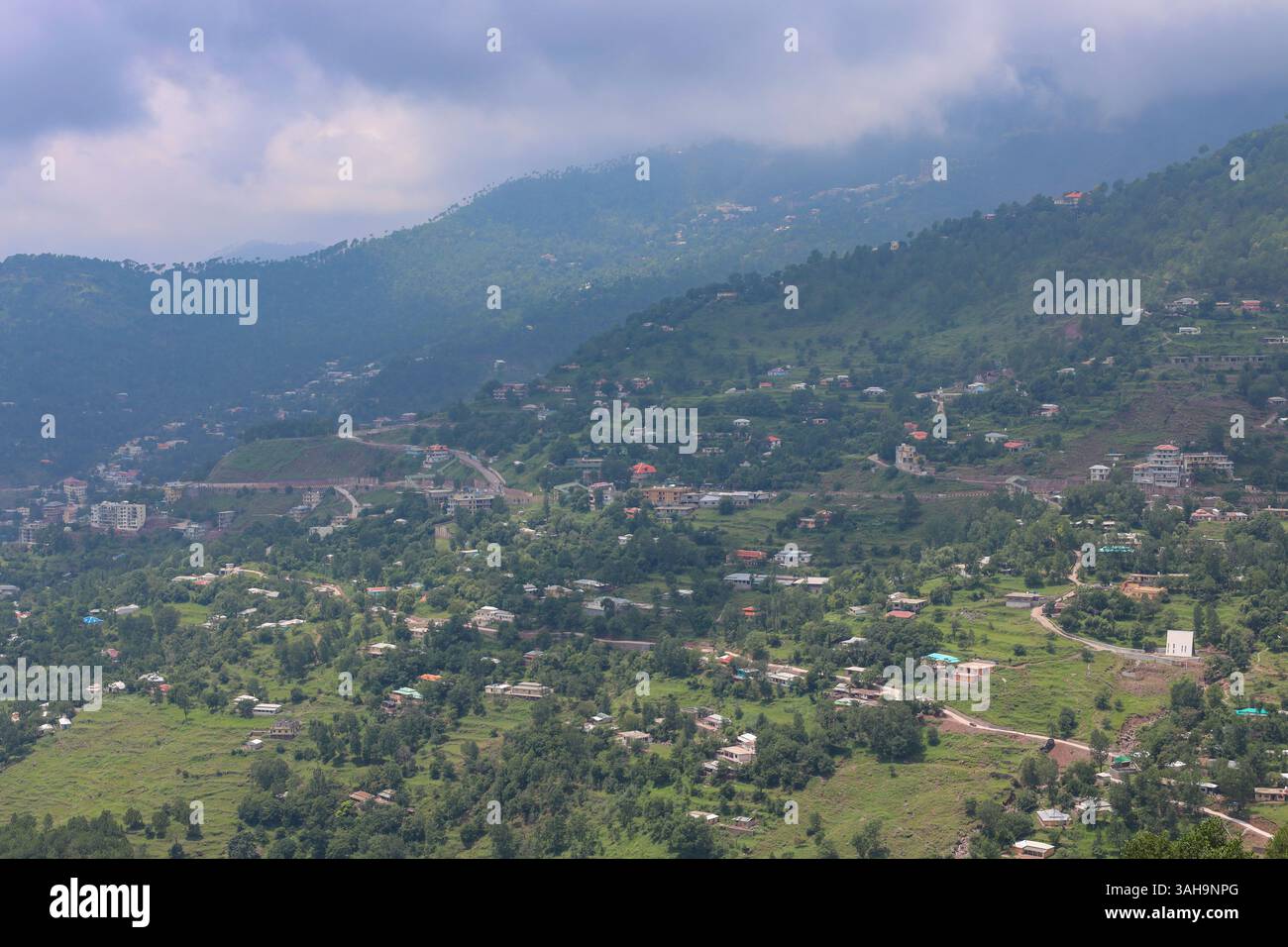 Lush green summer views of Murree, Punjab, Pakistan: houses and ...