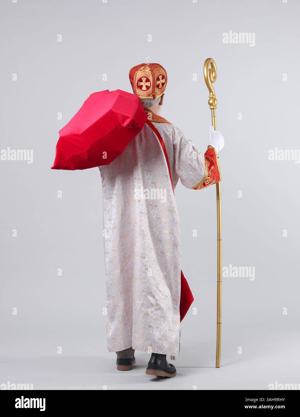 Saint Nicholas with sack on light grey background, back view Stock ...
