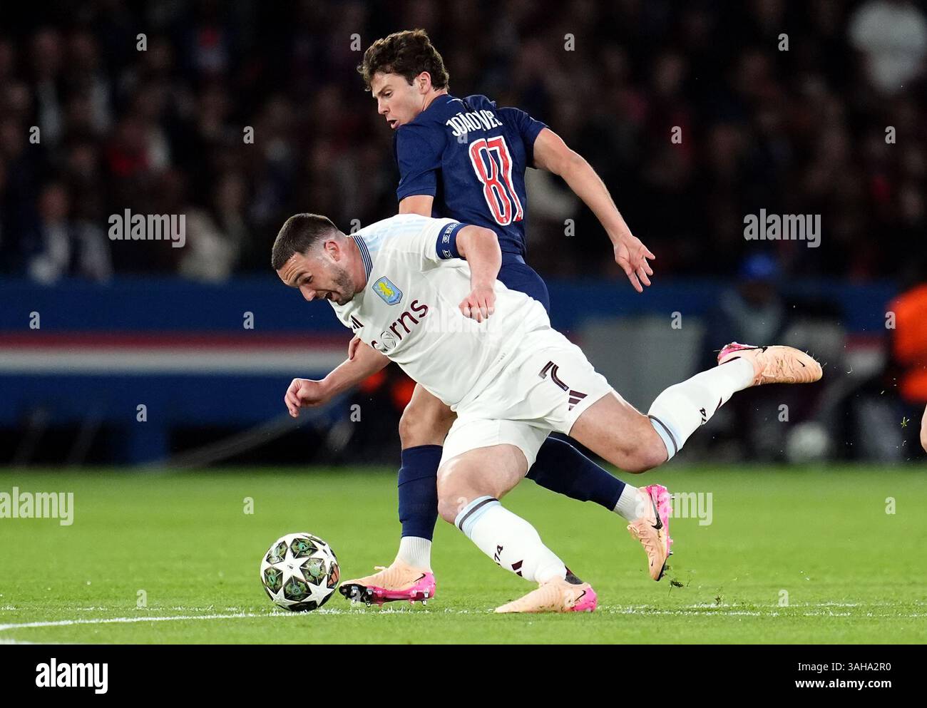 Aston Villa's John McGinn and Paris Saint-Germain's Joao Neves (right ...