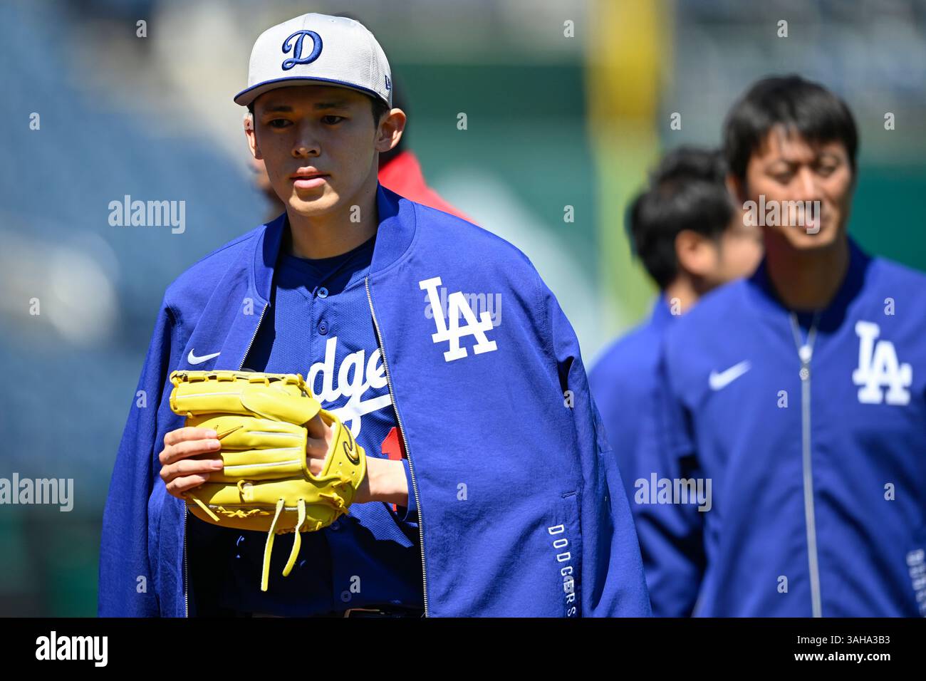 Los Angeles Dodgers pitcher Roki Sasaki walks to the dugout before a ...