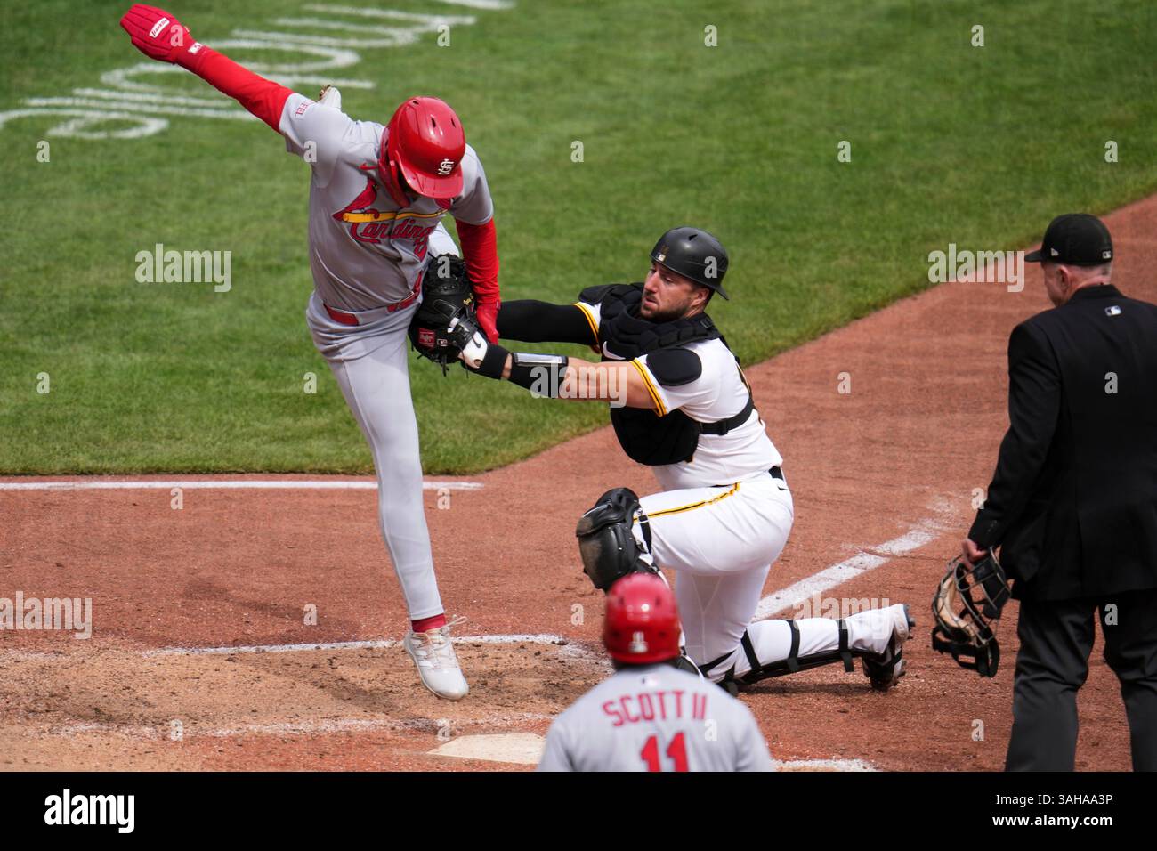 St. Louis Cardinals' Michael Siani, left, is tagged out by Pittsburgh ...