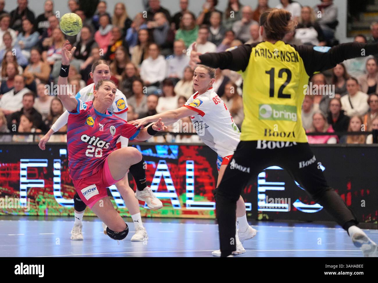 Germany's Emily B'lk, left vies for the ball with Denmark's Trine Ostergaard Jensen, center ...