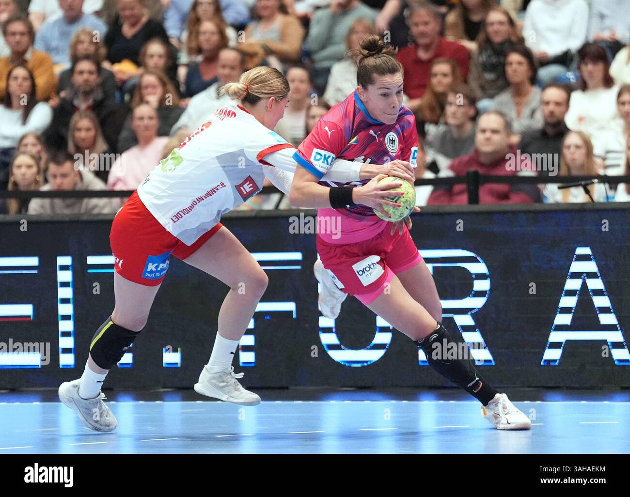 Germany's Emily B'lk, right, vies for the ball with Denmark's Kaja Kamp ...
