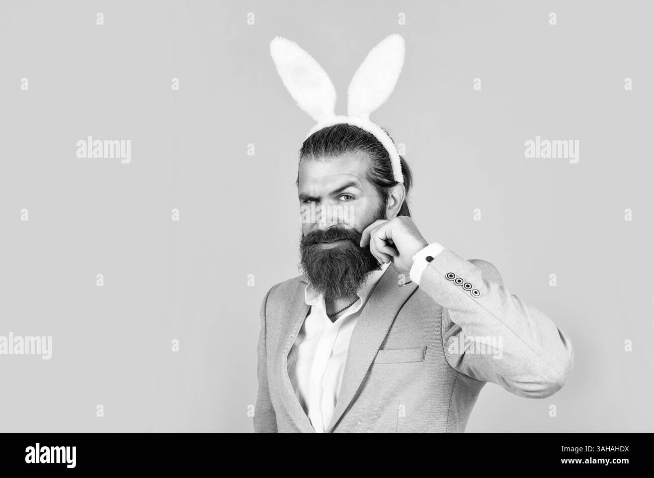 bearded man wear bunny ears. Egg hunt. spring holiday celebration ...