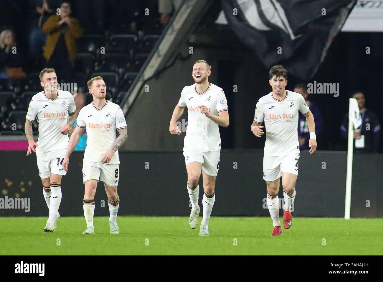Josh Key of Swansea City celebrates scoring his teams third goal during ...