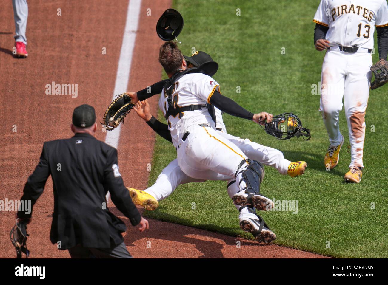 Pittsburgh Pirates first baseman Endy Rodríguez, rear, collides with ...