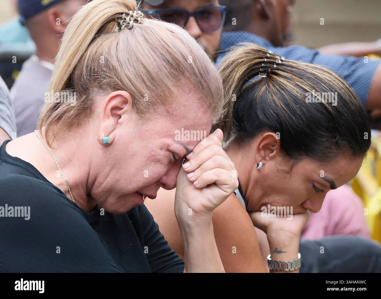 Women cry during the search for survivors at the Jet Set nightclub ...